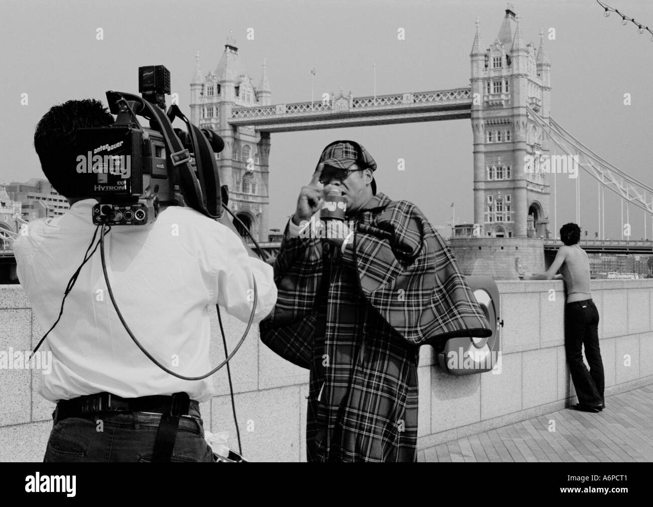 LONDON UK A television presenter discussing London s Tower Bridge Stock ...