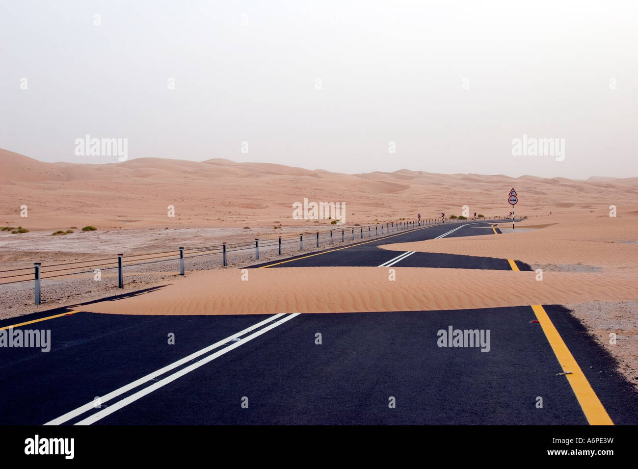 Sand drifting across the road Stock Photo - Alamy