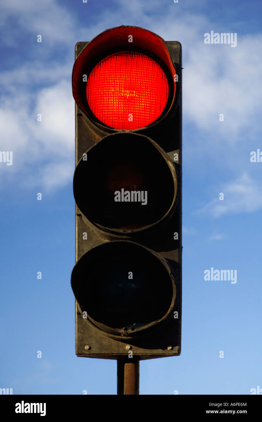 Red traffic light against blue sky Stock Photo - Alamy