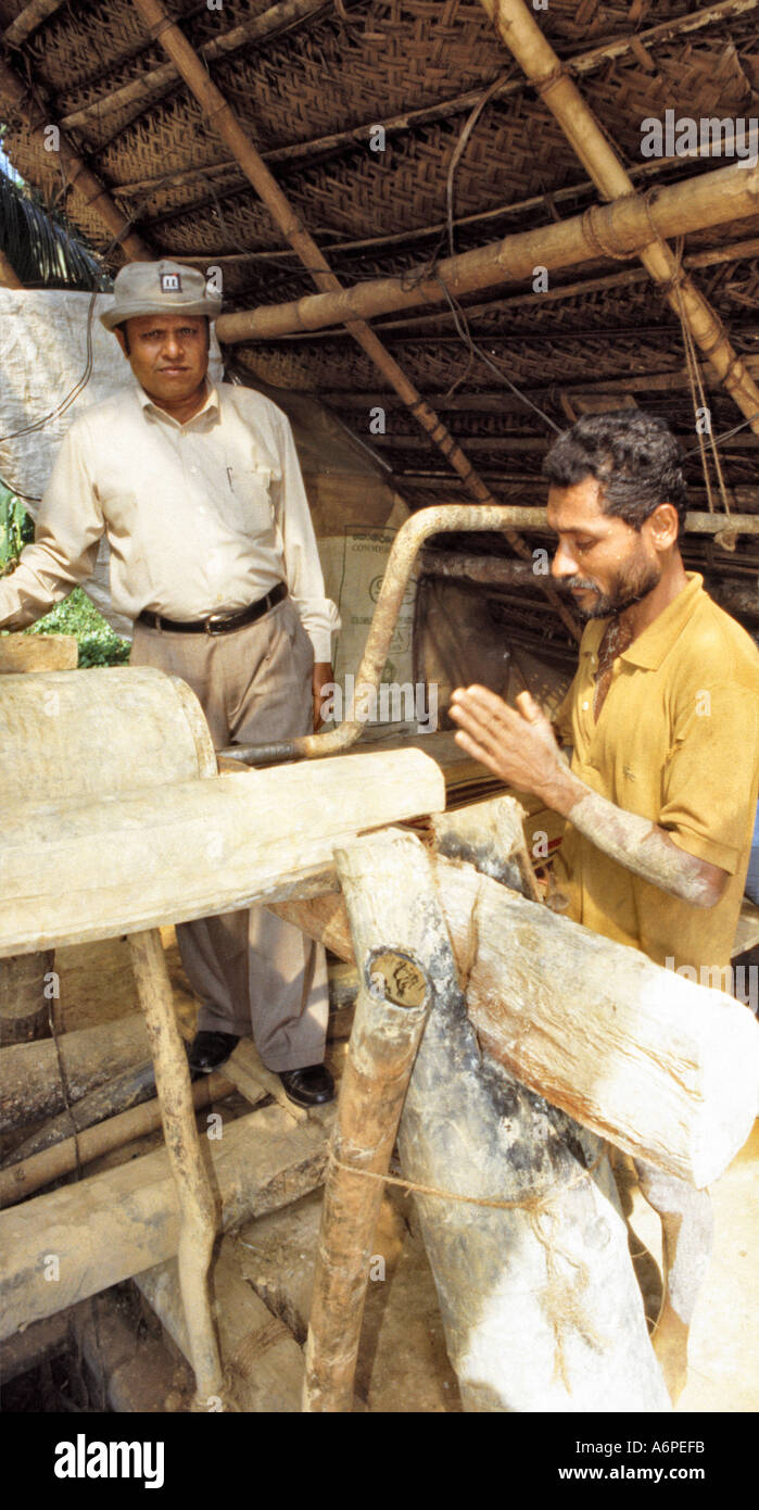 A miner prays before climbing into a 40ft deep gem mine near Ratnapura ...