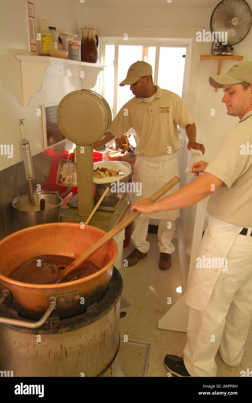 USA Michigan Mackinac Island Lake Huron two men making fudge in a vat ...