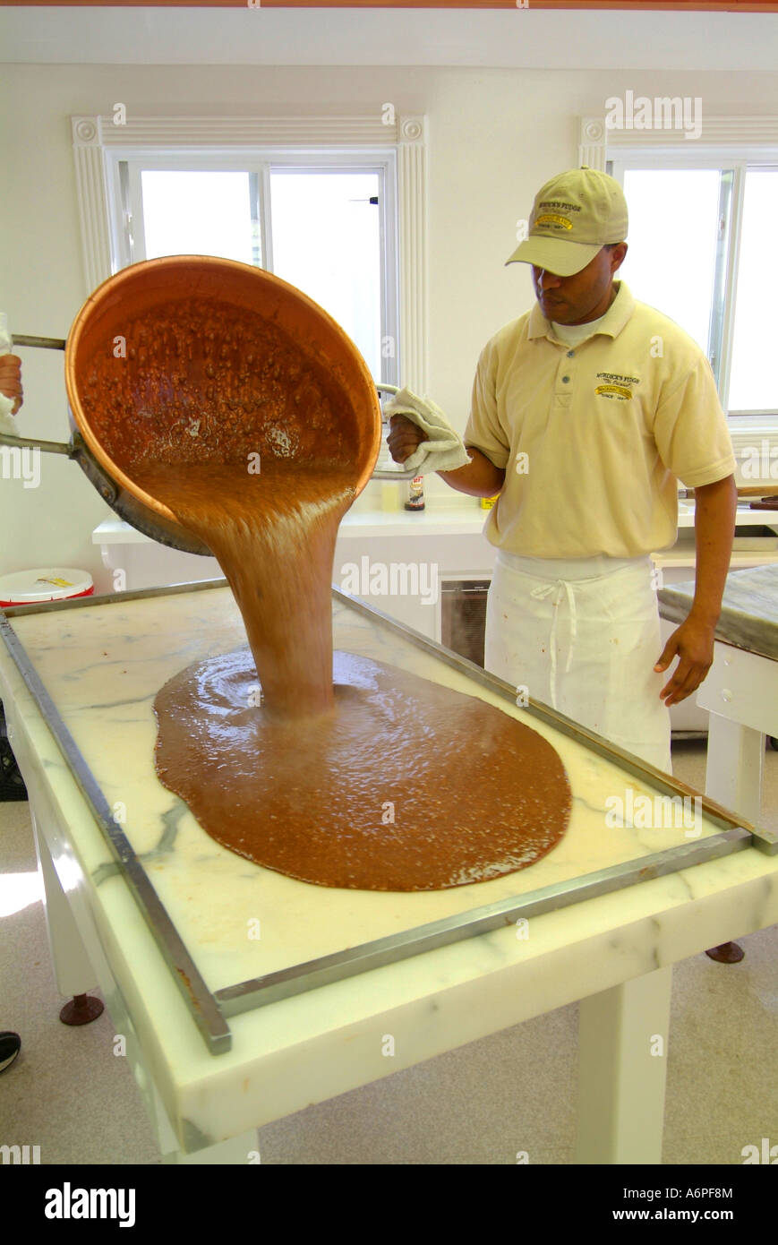 USA Michigan Mackinac Island Lake Huron Man making fudge on a marble ...