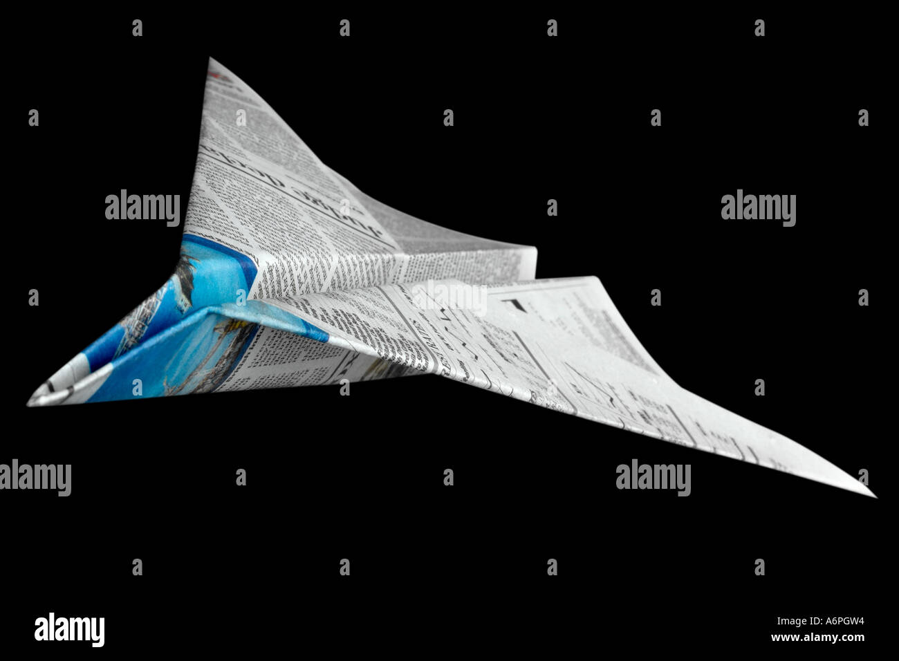 A person throwing a Paper airplane made from newspaper Stock Photo - Alamy