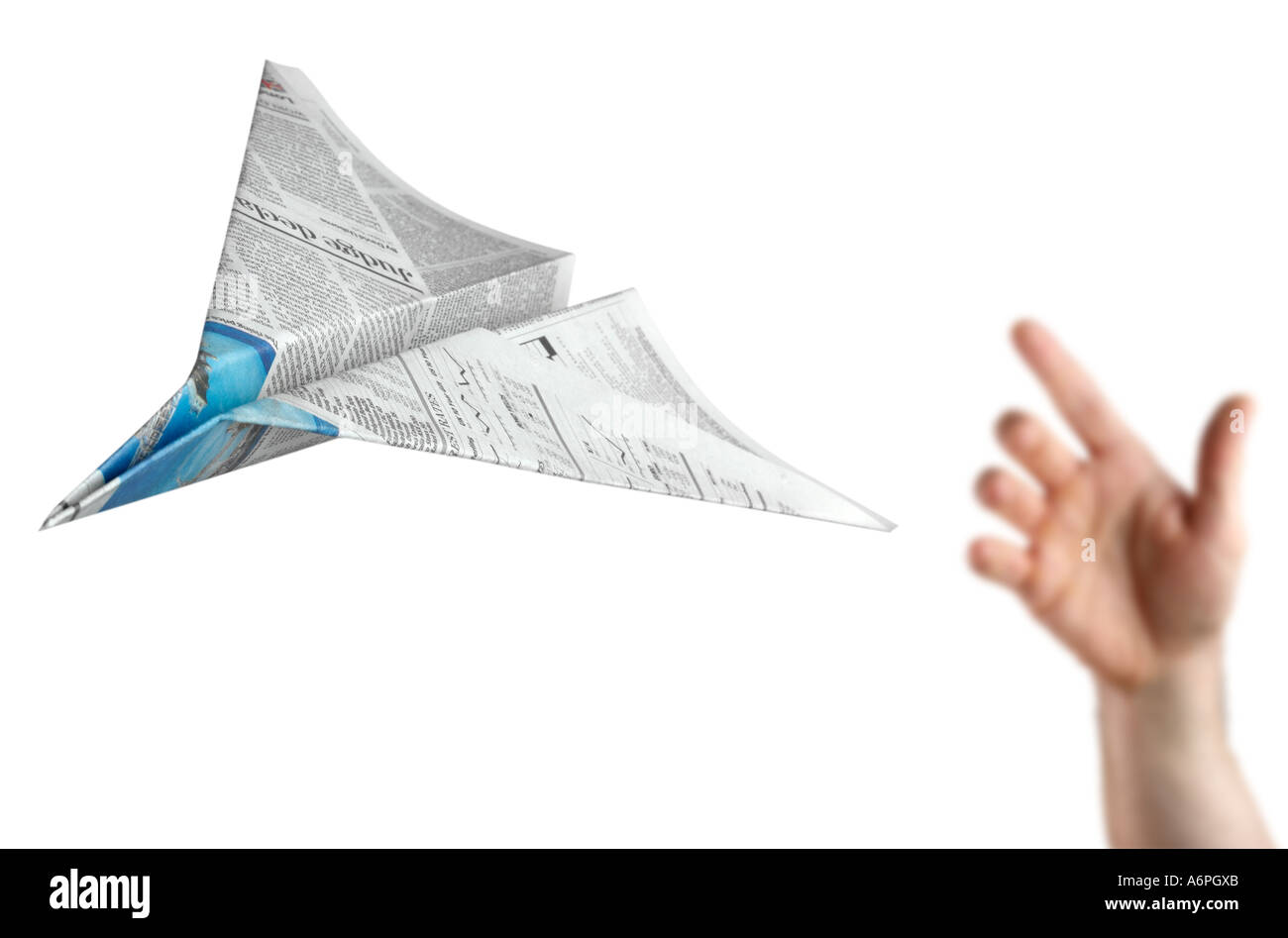A person throwing a Paper airplane made from newspaper Stock Photo - Alamy