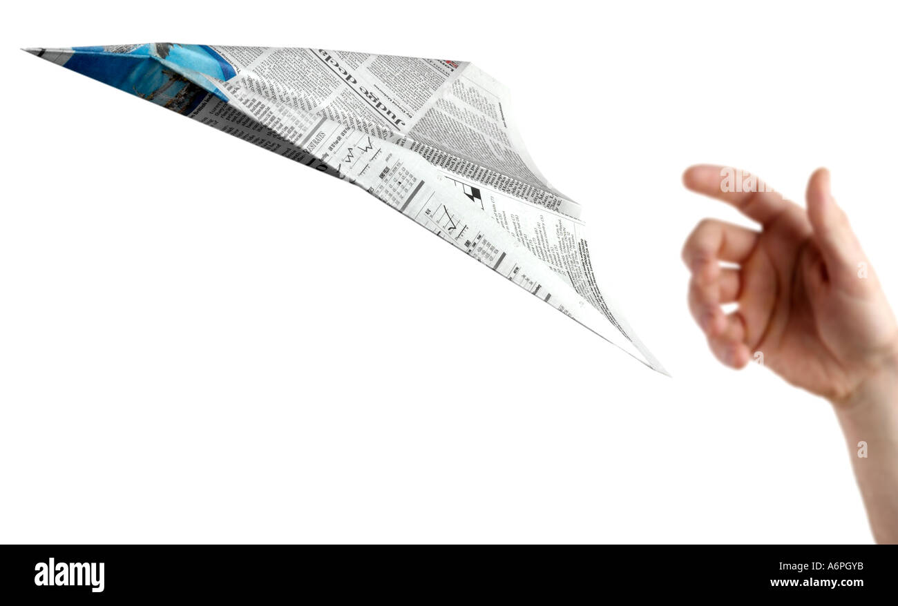 A person throwing a Paper airplane made from newspaper Stock Photo - Alamy