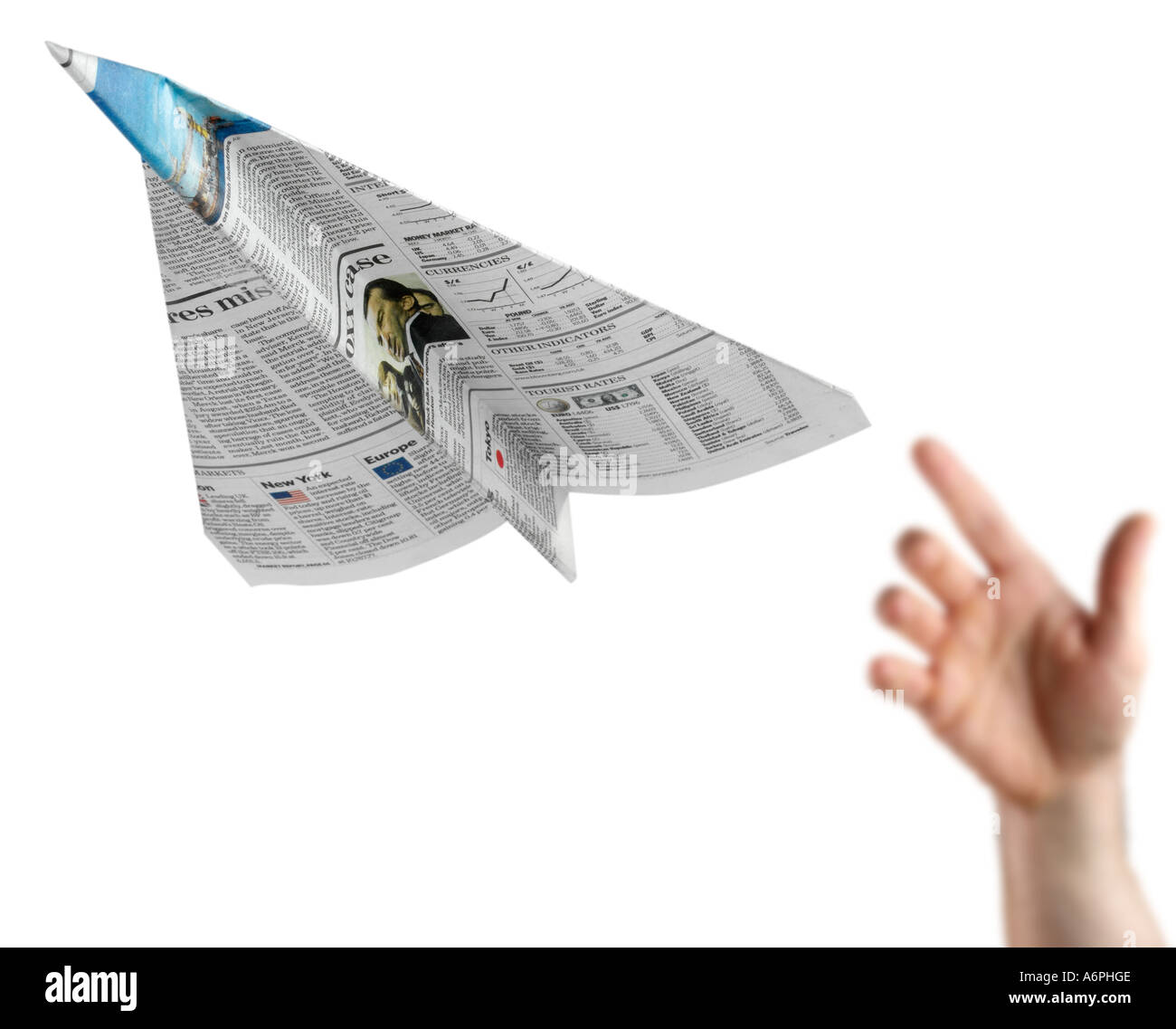 A person throwing a Paper airplane made from newspaper Stock Photo - Alamy