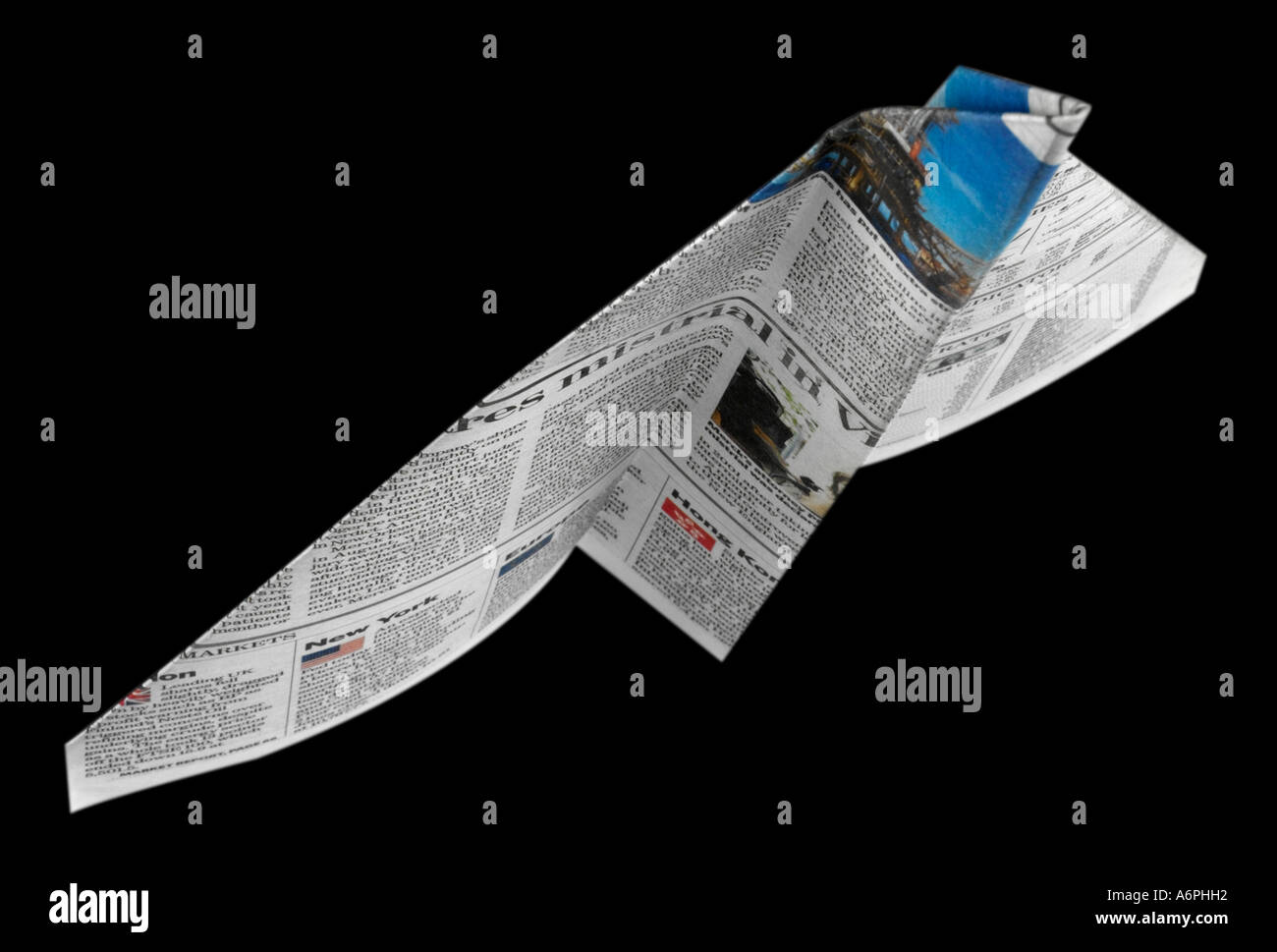 A person throwing a Paper airplane made from newspaper Stock Photo - Alamy