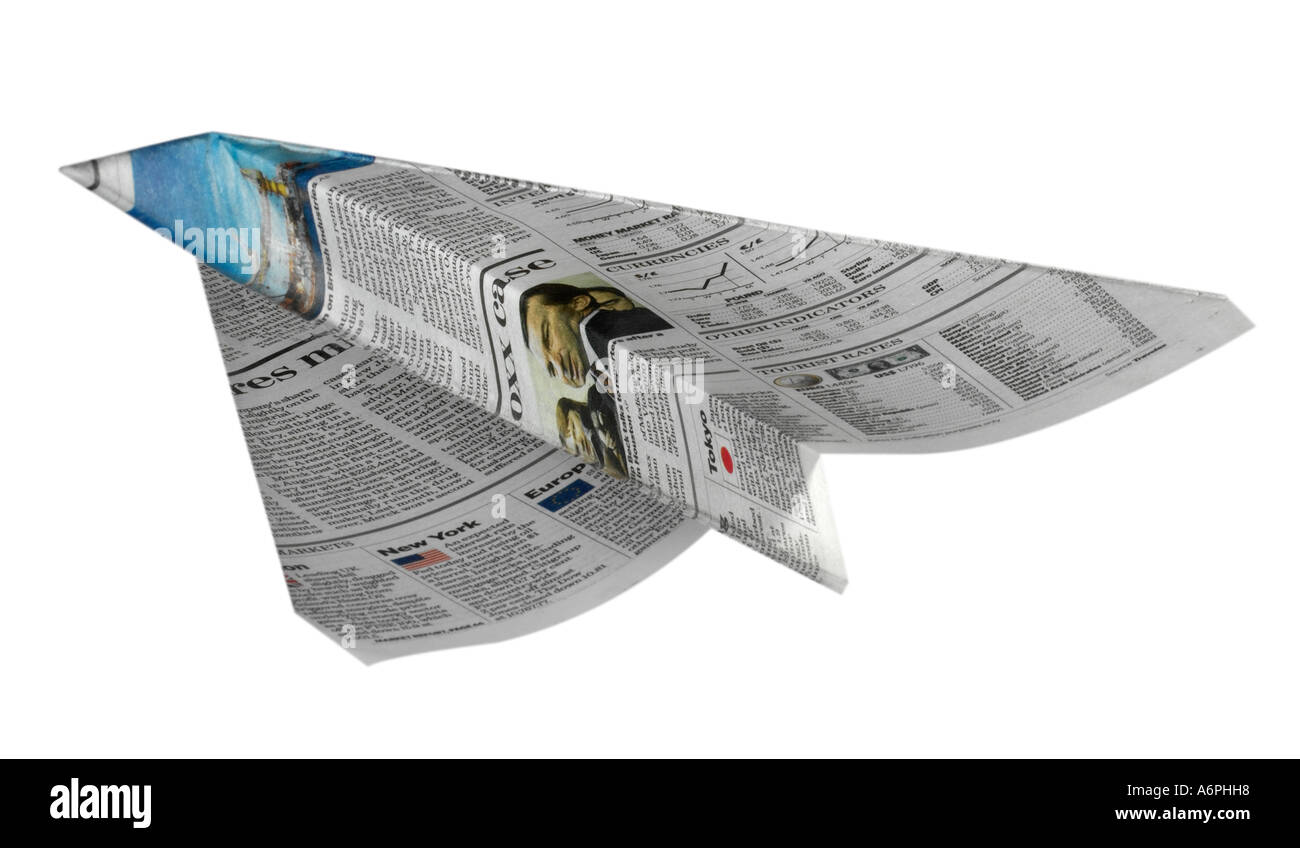 A person throwing a Paper airplane made from newspaper Stock Photo - Alamy