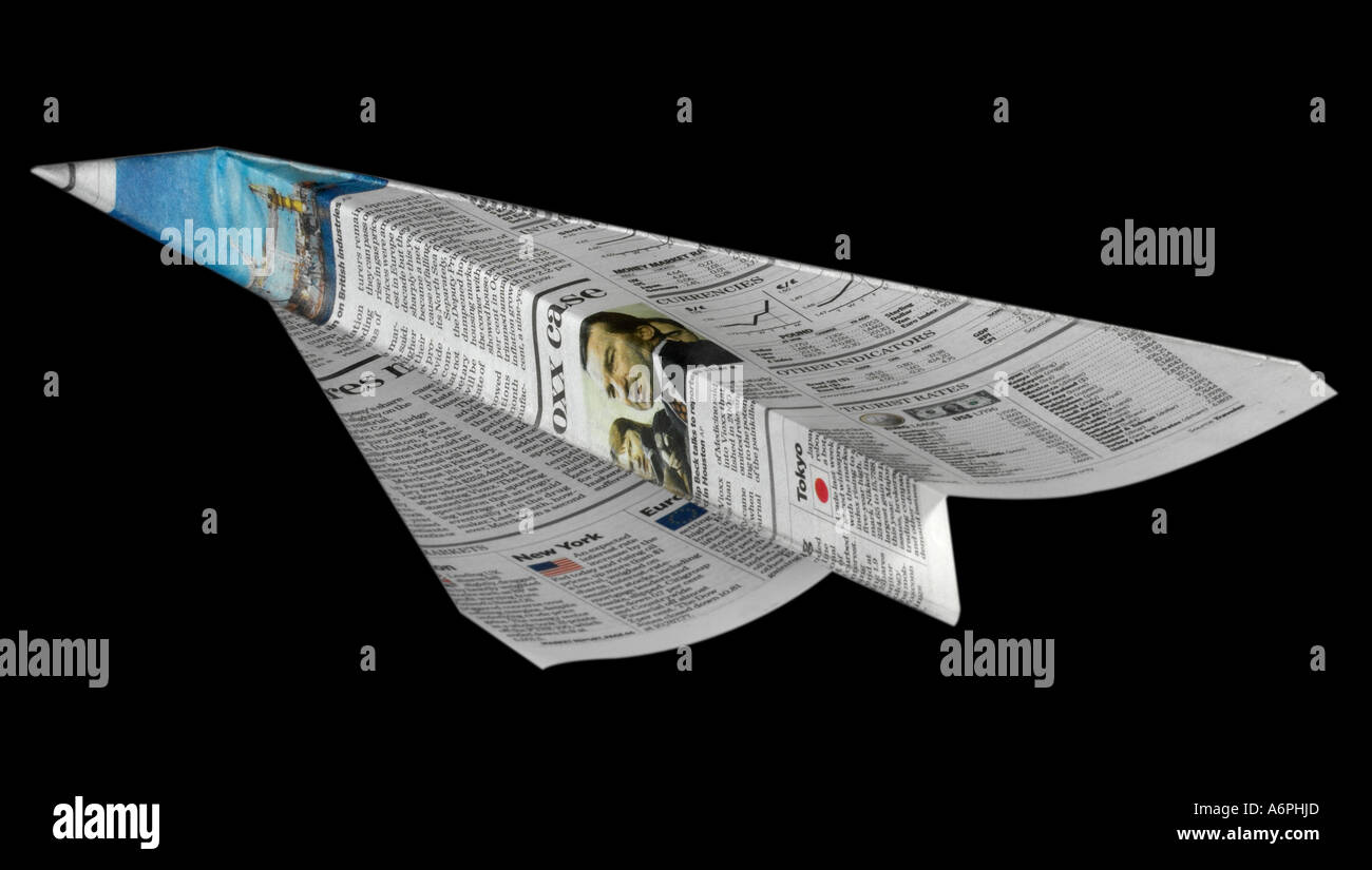 A person throwing a Paper airplane made from newspaper Stock Photo - Alamy