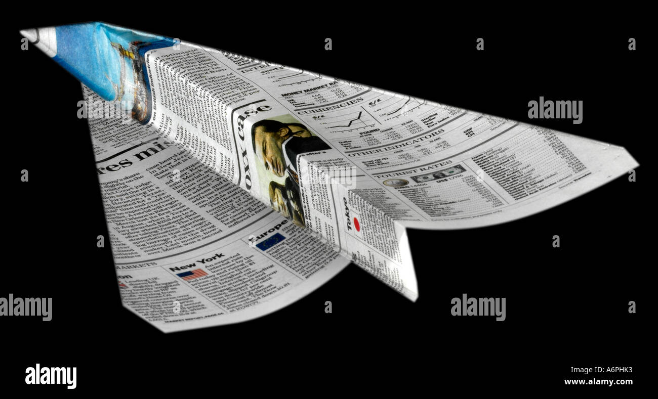 A person throwing a Paper airplane made from newspaper Stock Photo - Alamy