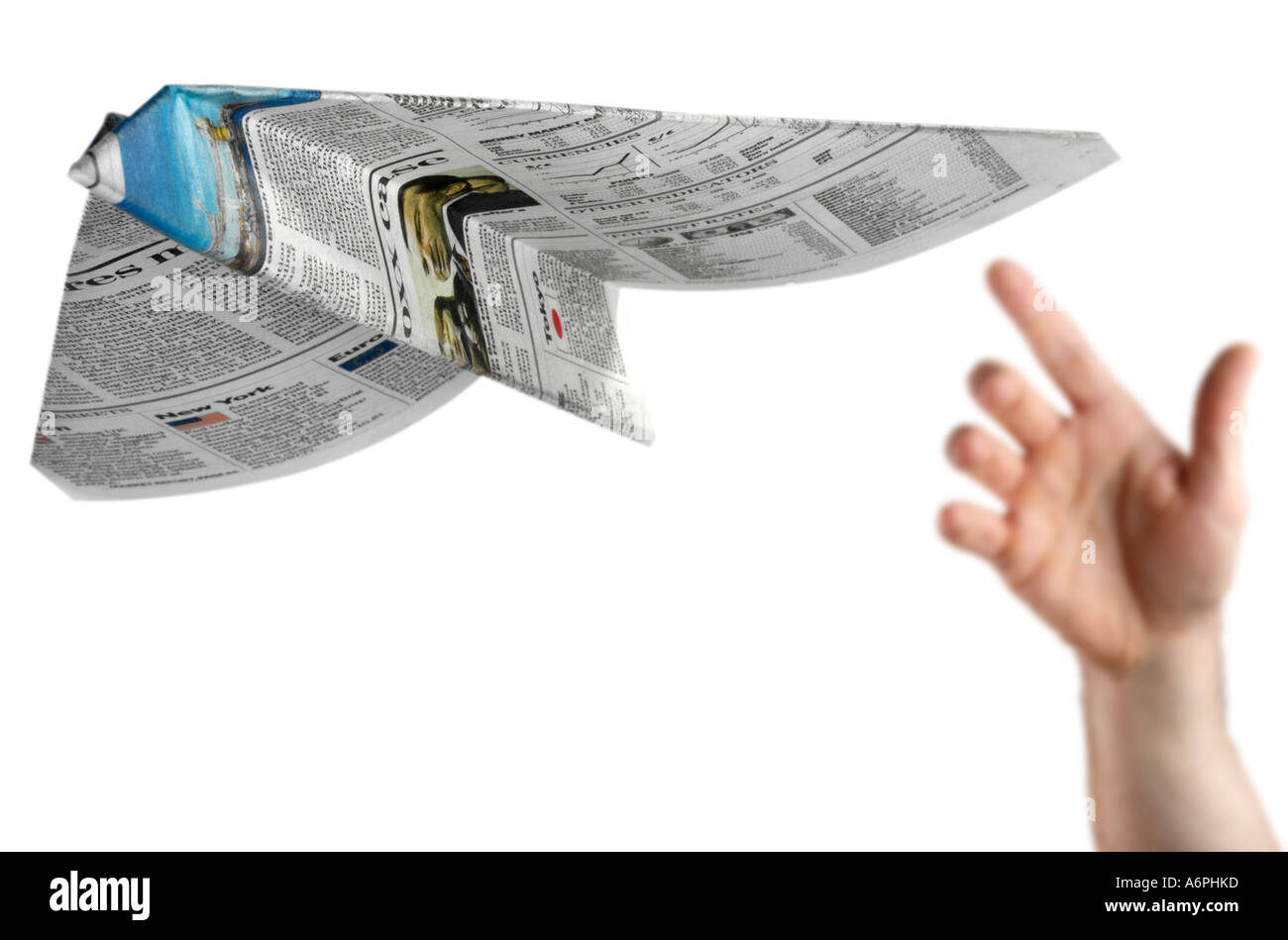A person throwing a Paper airplane made from newspaper Stock Photo - Alamy