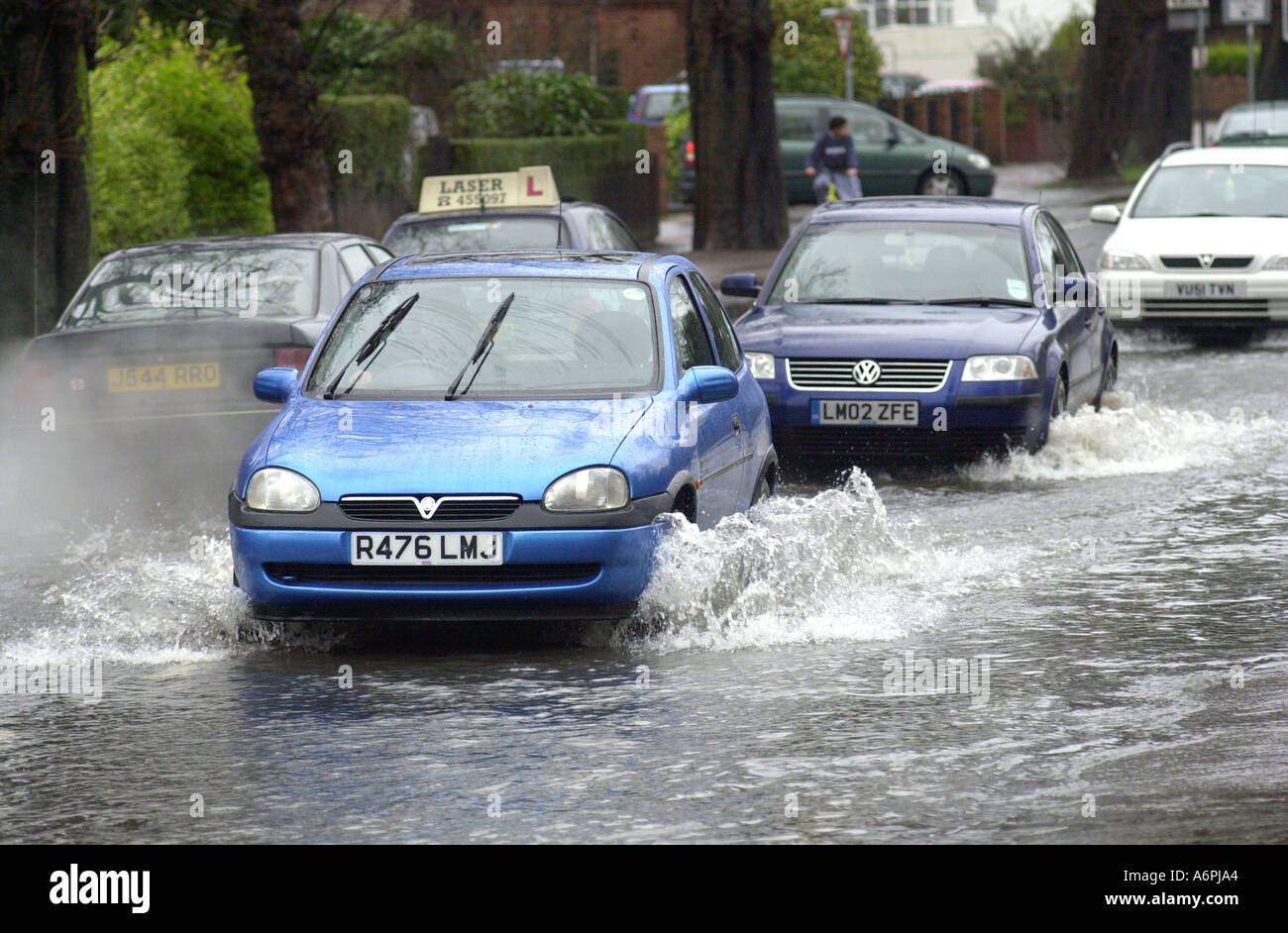 Cars drive through flood water in Luton Beds UK Stock Photo - Alamy