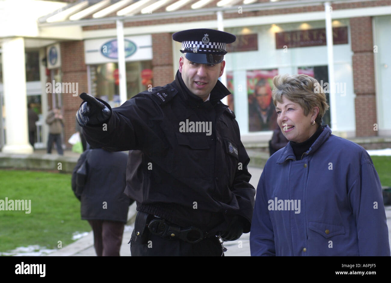 Police officer gives directions to a woman asking the way UK Stock ... Police officer gives directions to a woman asking the way UK Stock ...