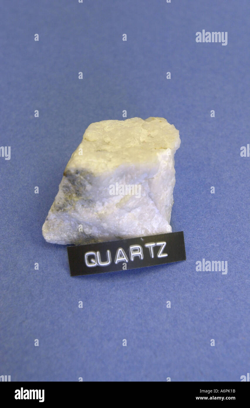Quartz crystal with label on a blue background UK Stock Photo - Alamy