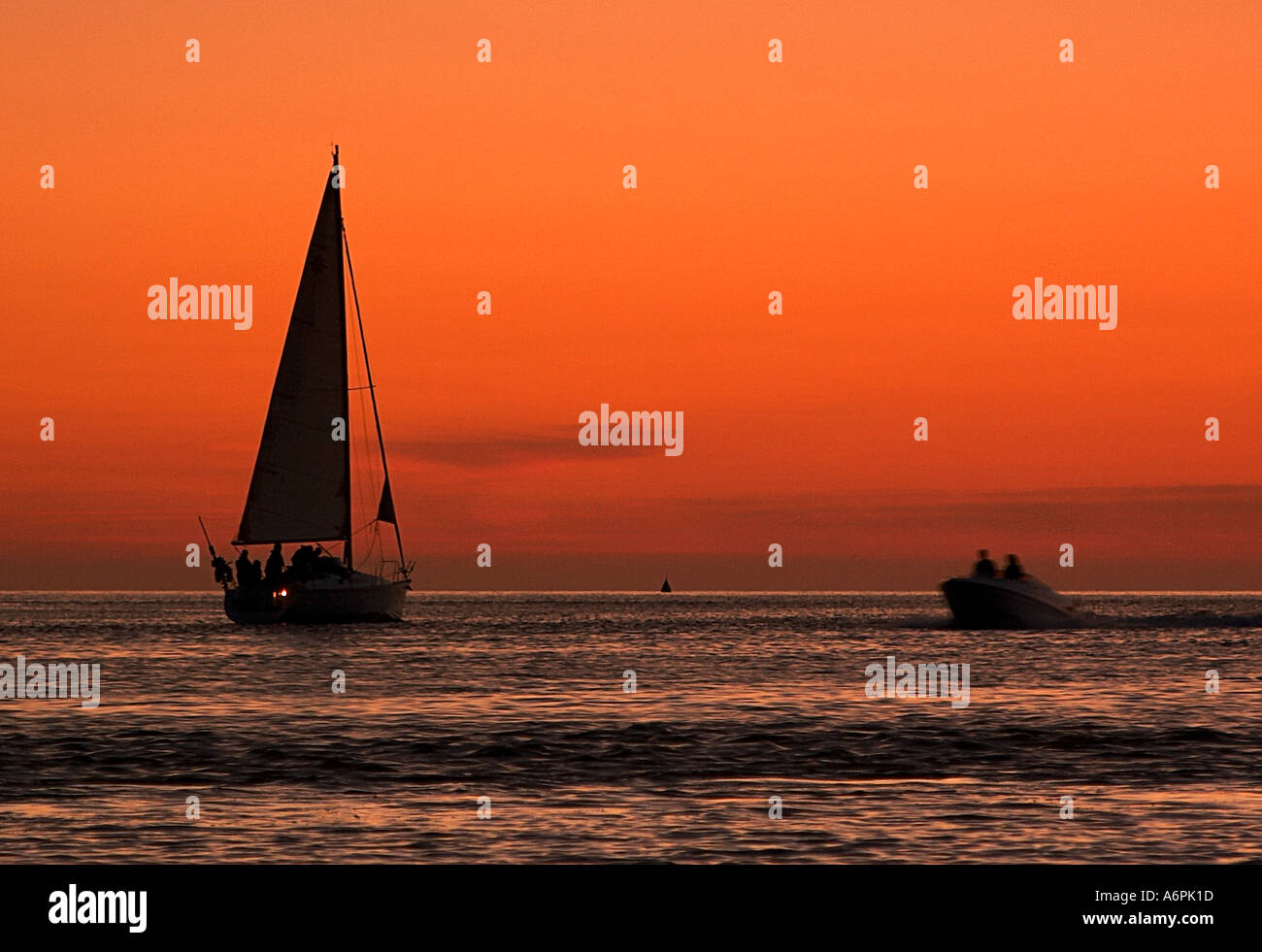 Slow Boat Fast Boat A motor boat and yacht catching the incoming tide ...