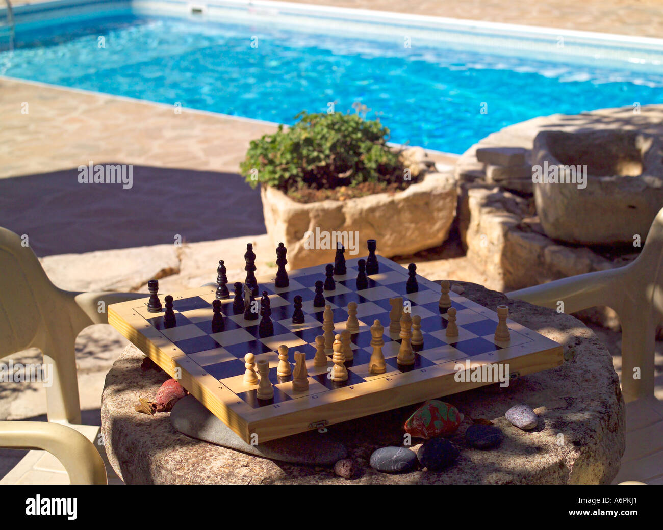 A GAME OF CHESS NEXT TO A SWIMMING POOL Stock Photo - Alamy