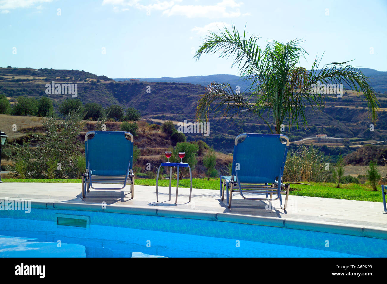 scenic view of sunbeds and swimming pool in cyprus Stock Photo - Alamy