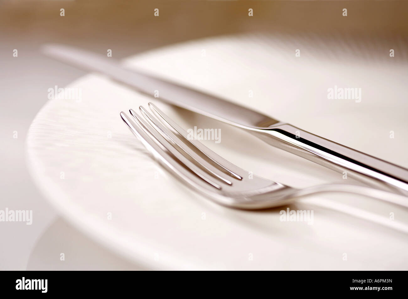 Plate with fork and knife Stock Photo - Alamy