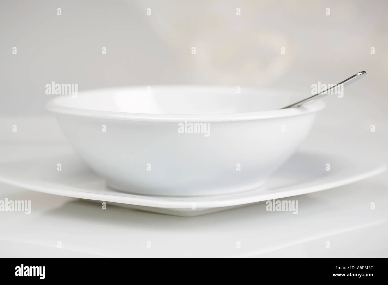 Soup plate with spoon Stock Photo - Alamy