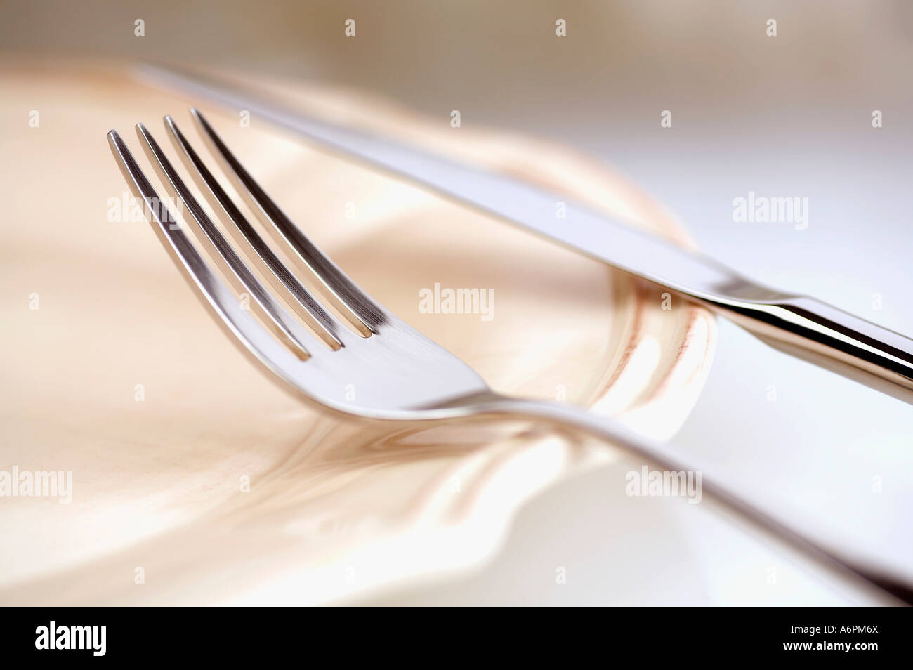 Plate with fork and knife Stock Photo - Alamy