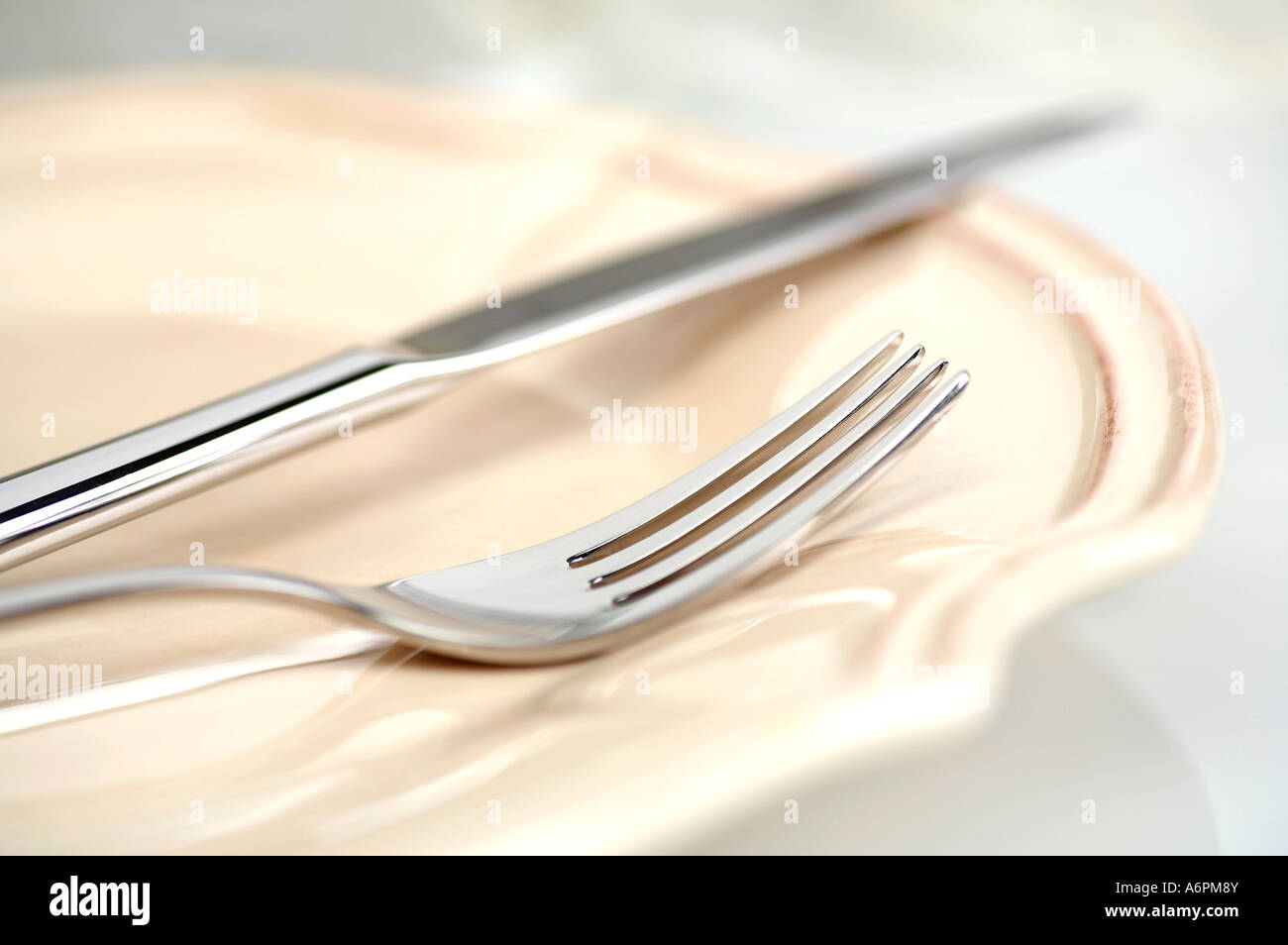 Plate with fork and knife Stock Photo - Alamy