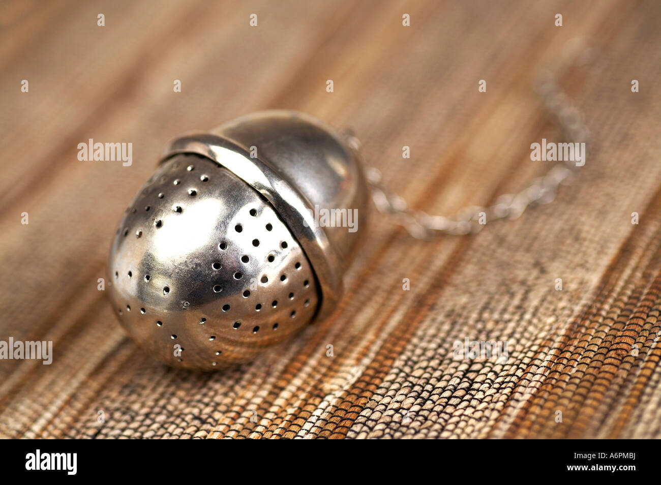 Tea infuser on cloth Stock Photo - Alamy