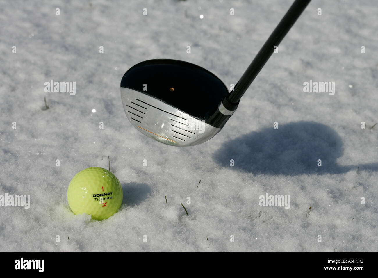 Close up of a yellow golf ball snow golf club sport game chill out ...
