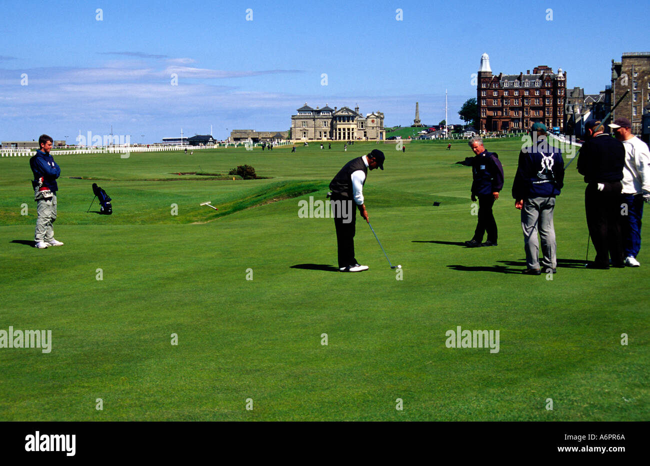 A group of golfers putting out on the Old Course St Andrews Stock Photo ...