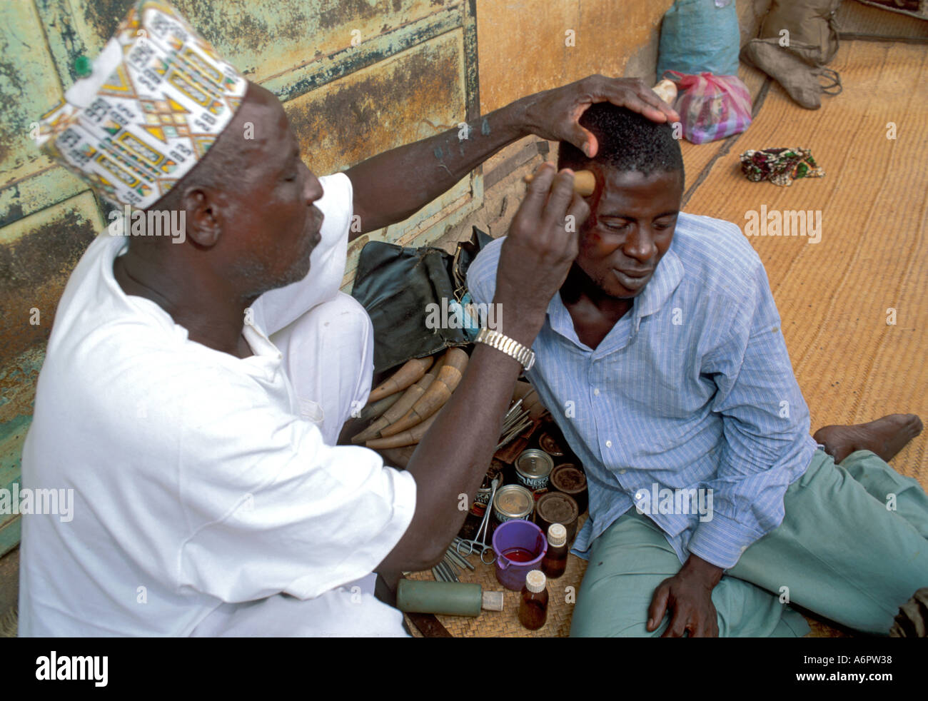 Traditional healer treating a man. Mali Stock Photo - Alamy