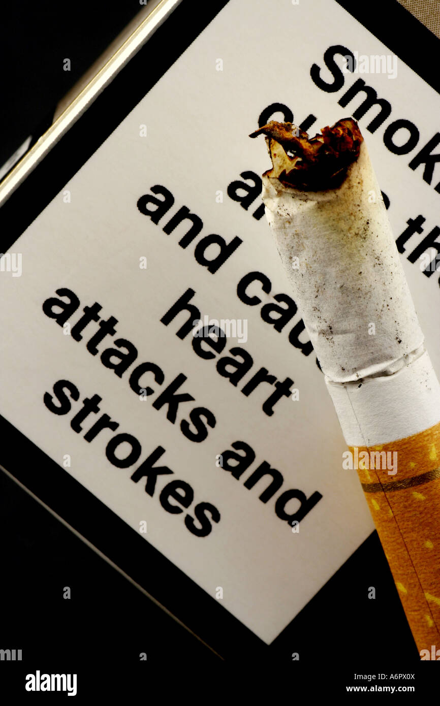 Cigarette and health warning Stock Photo - Alamy