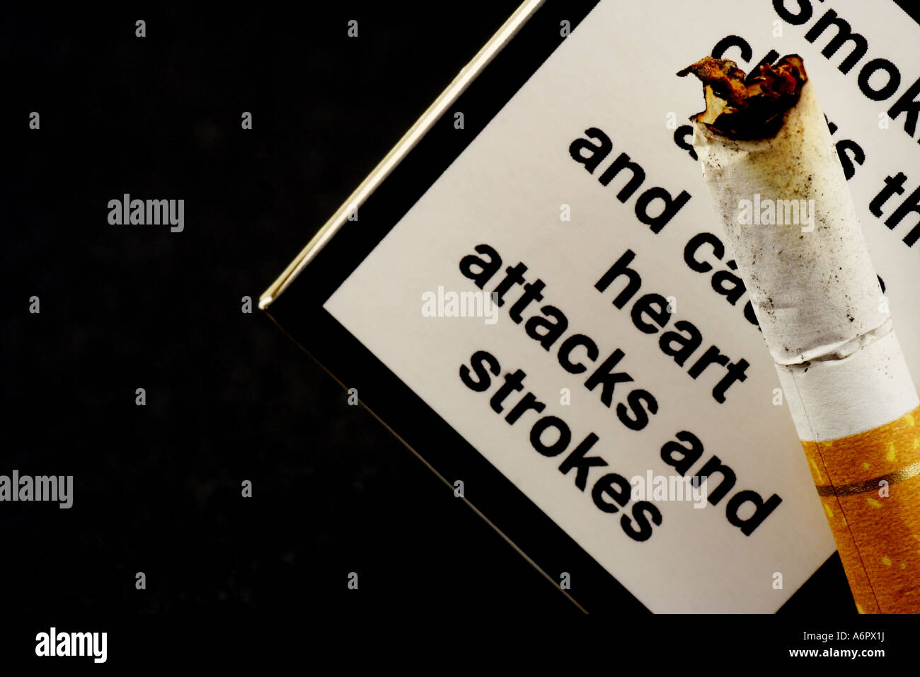 Cigarette and packet health warning Stock Photo - Alamy