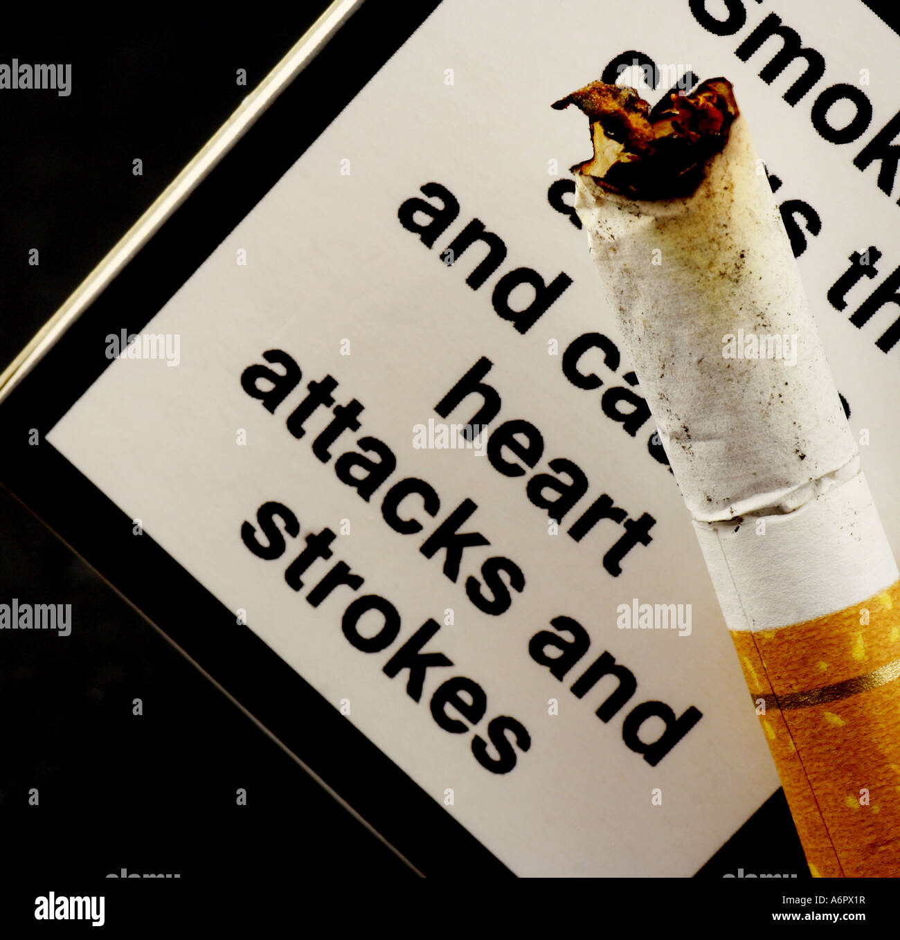 Cigarette and packet health warning Stock Photo - Alamy
