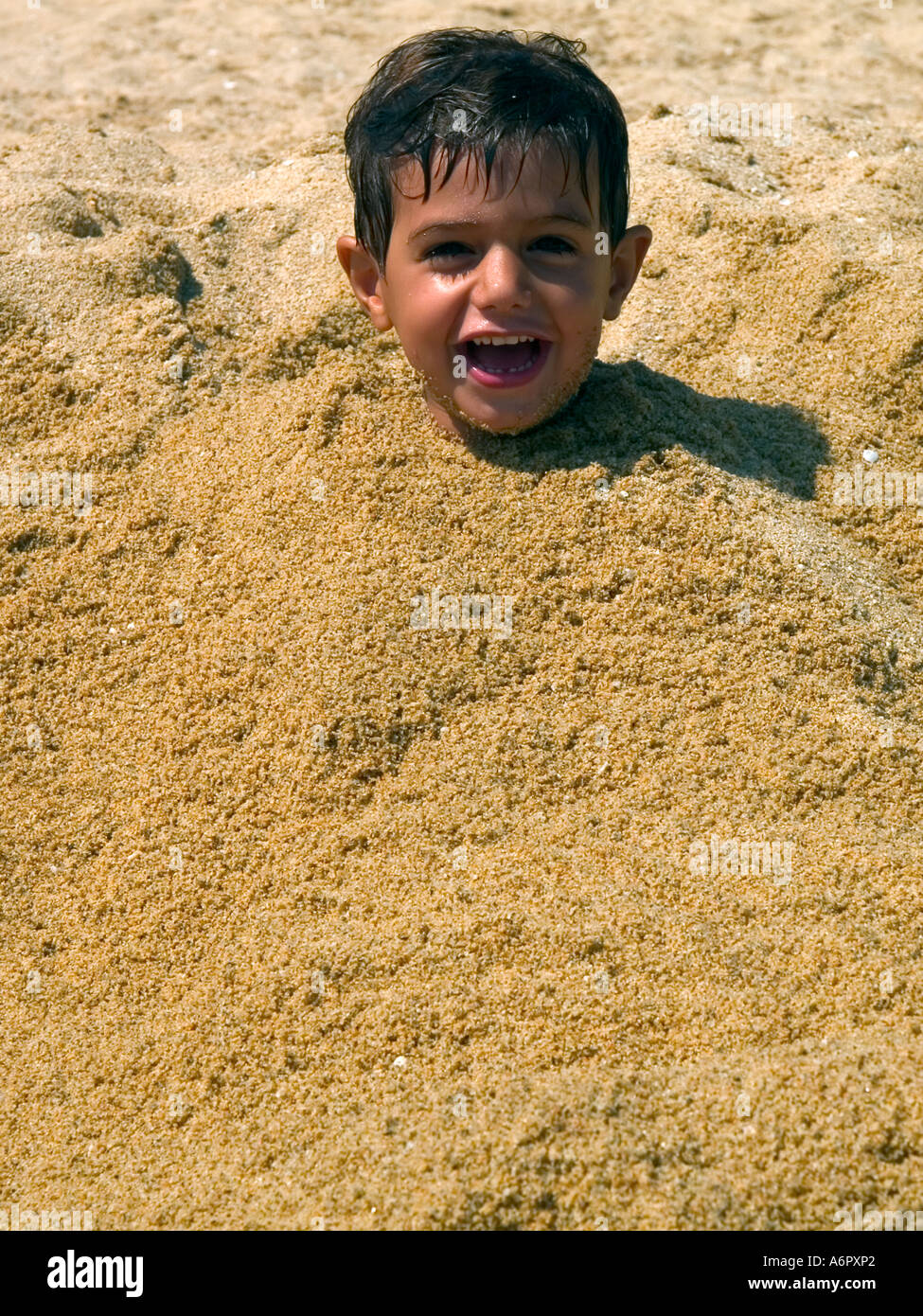 kids playing on the beach, spain Stock Photo - Alamy