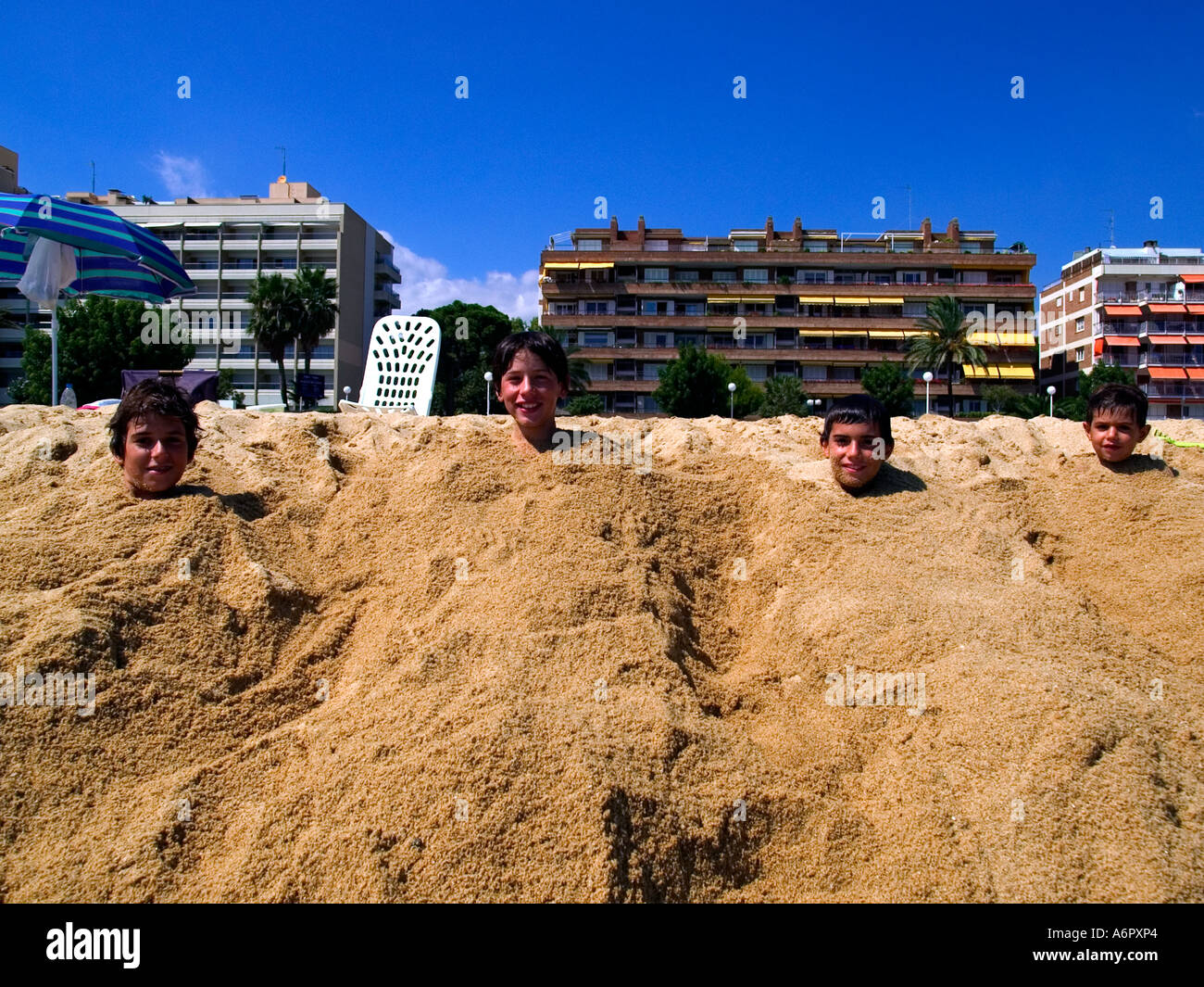 kids playing on the beach, spain Stock Photo - Alamy