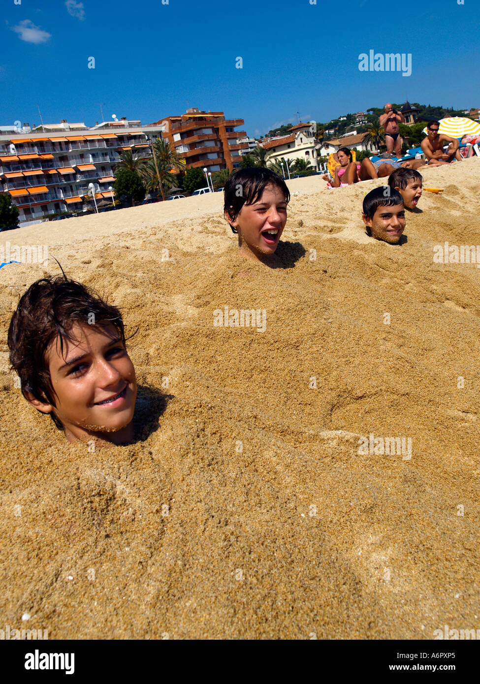 kids playing on the beach, spain Stock Photo - Alamy