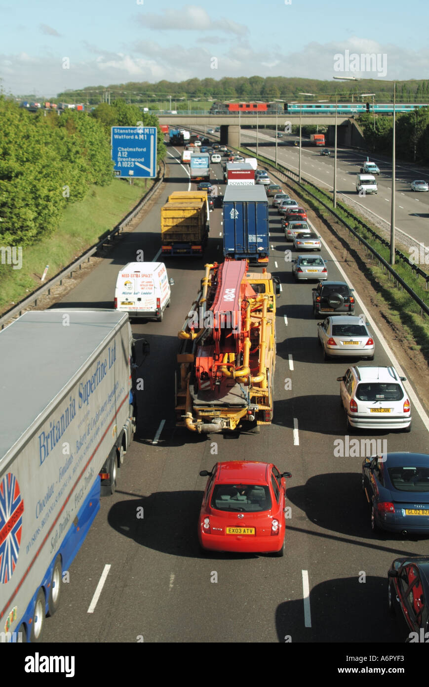 Transport choice M25 motorway nose to tail slow moving traffic watching ...