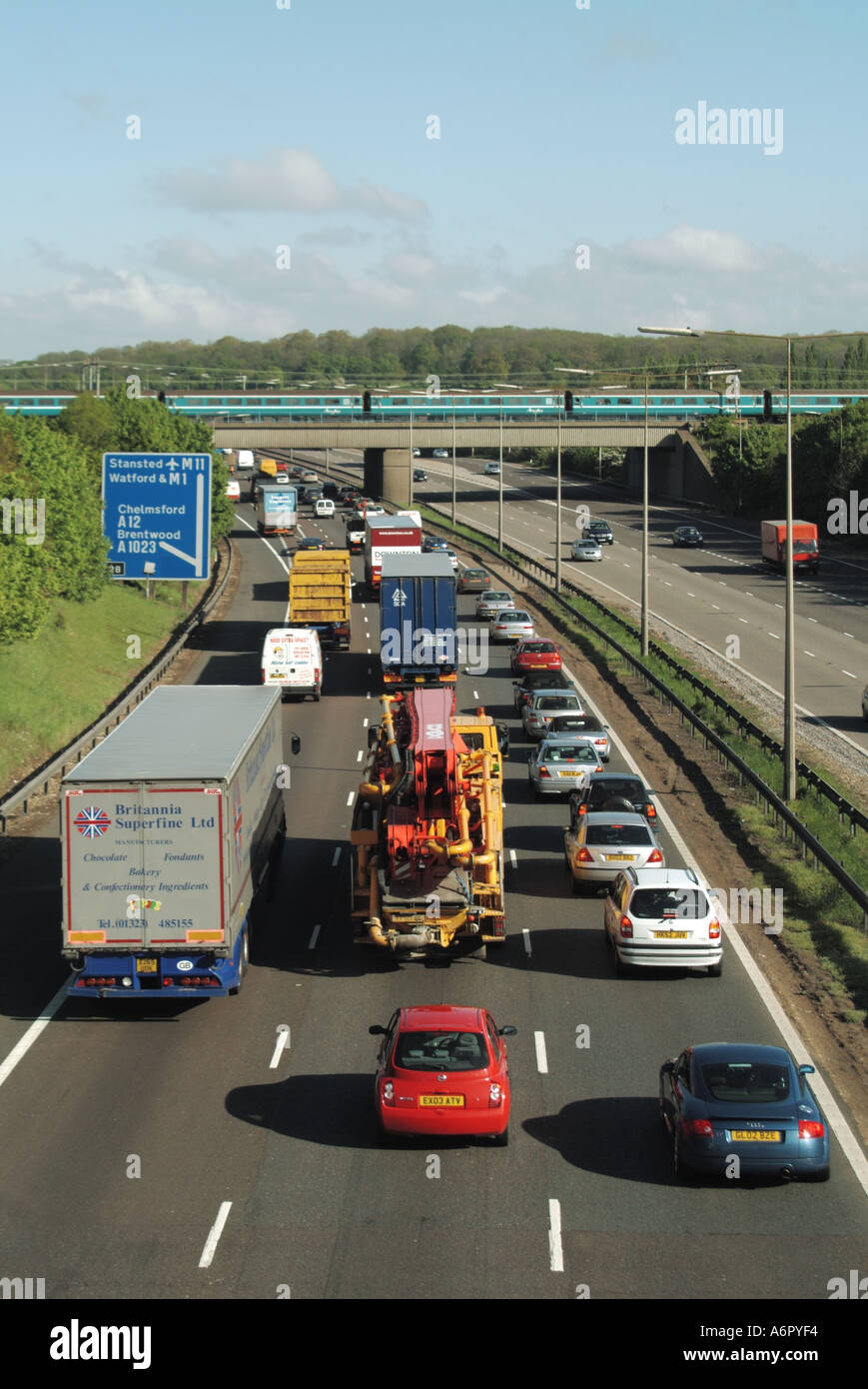 Transport choice M25 motorway nose to tail slow moving traffic watching ...
