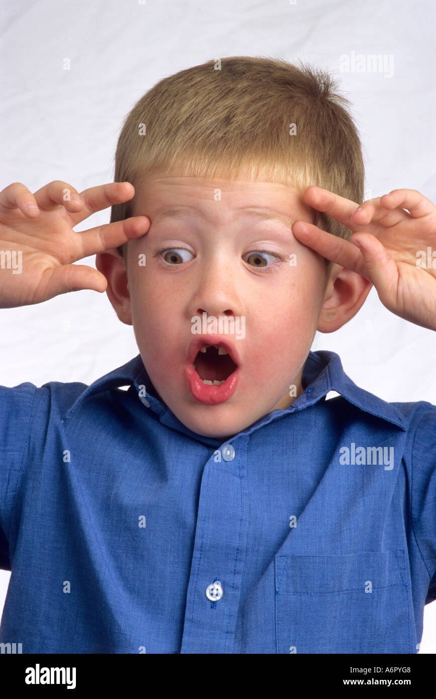 Child Boy portrait making a face Stock Photo - Alamy