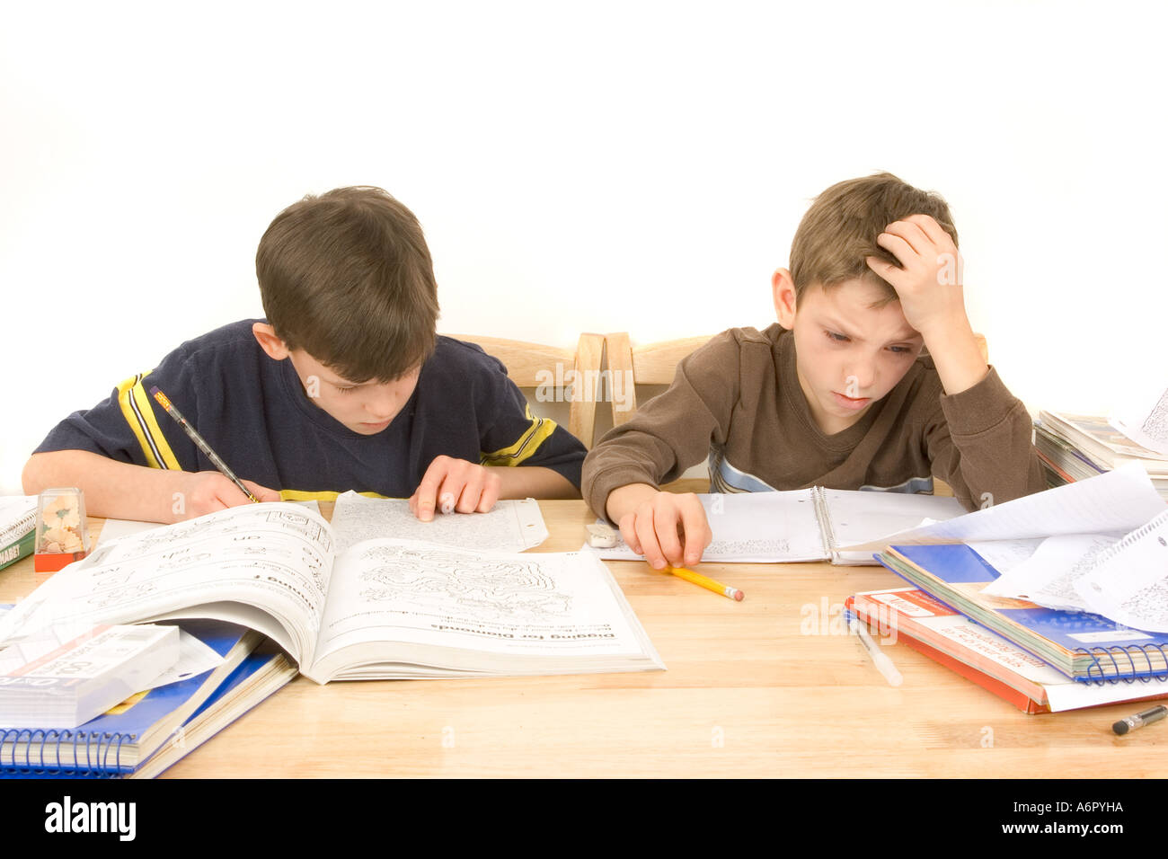 Boys doing home work study Stock Photo - Alamy