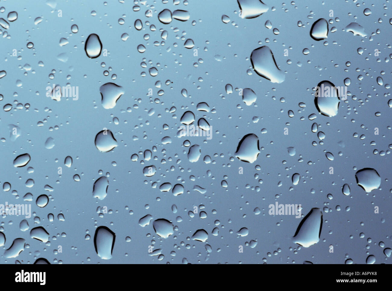 Rain drops on window close up storm Stock Photo - Alamy