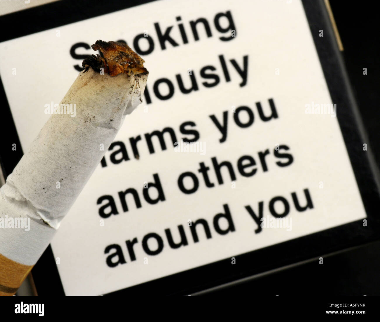 Cigarette and health warning Stock Photo - Alamy