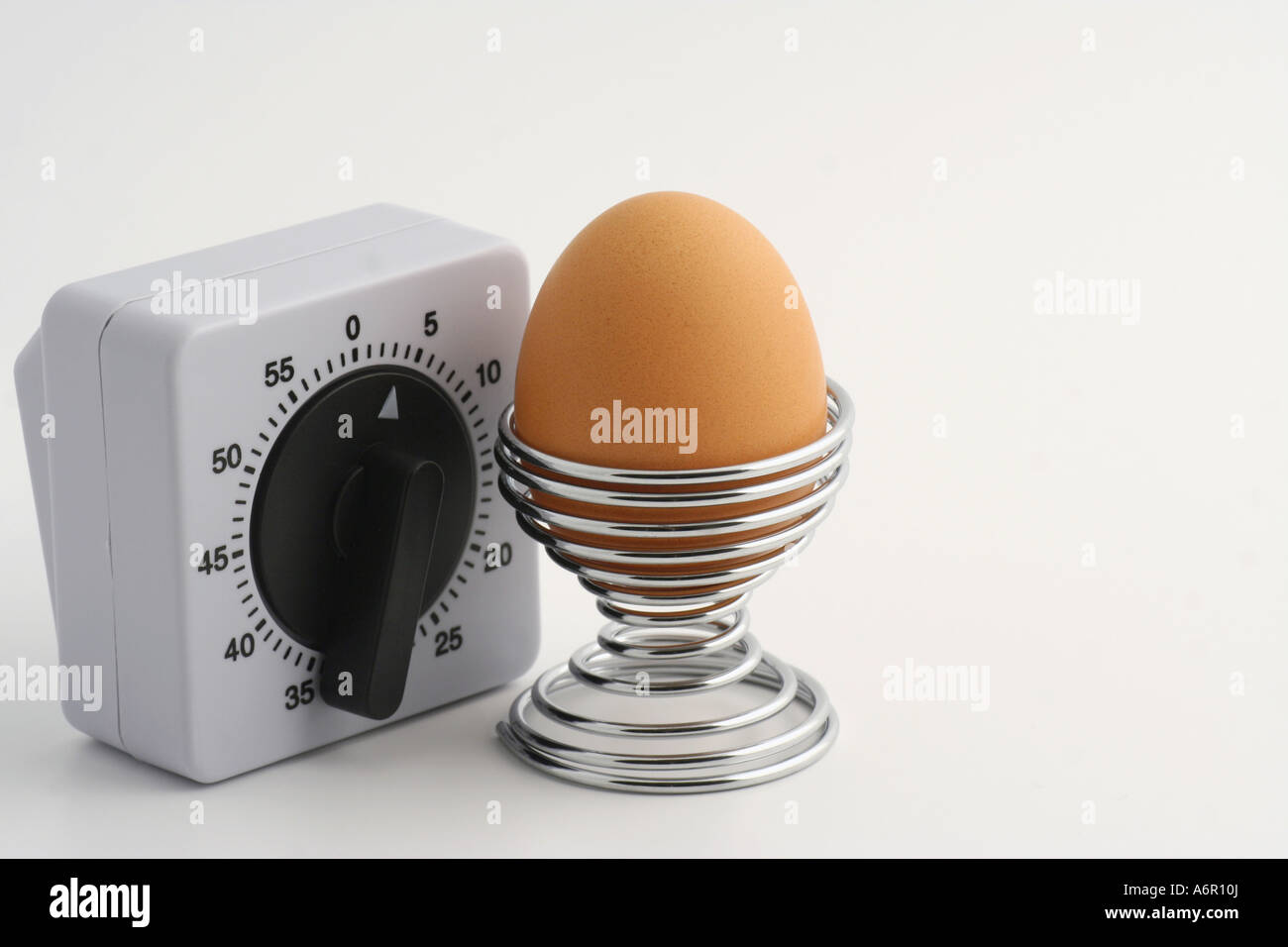 Timer and egg Stock Photo - Alamy