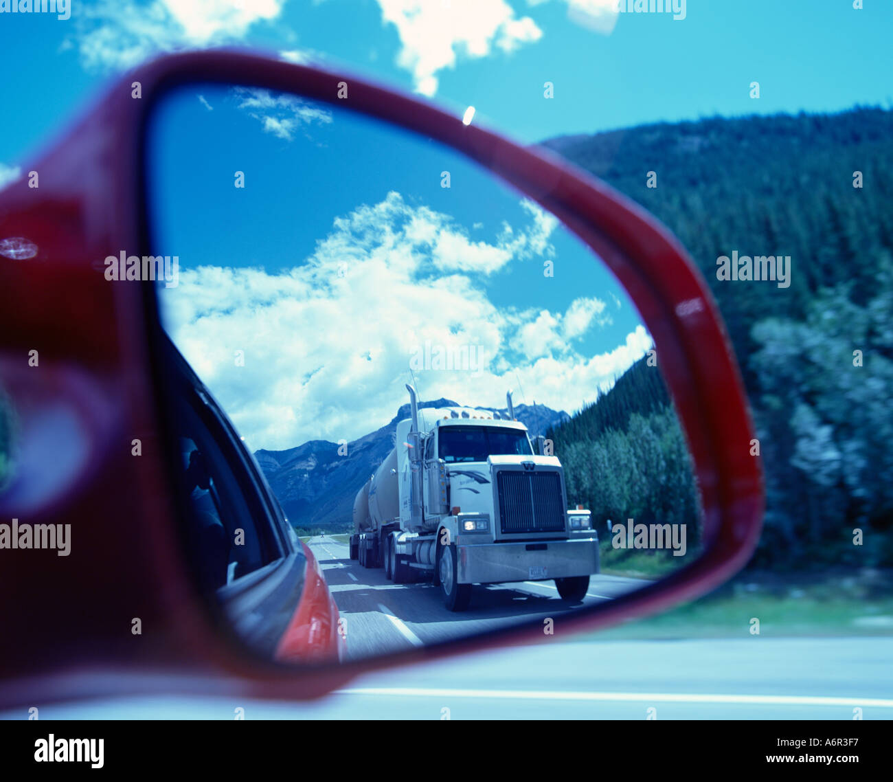 Lorry in wing mirror of car Stock Photo - Alamy