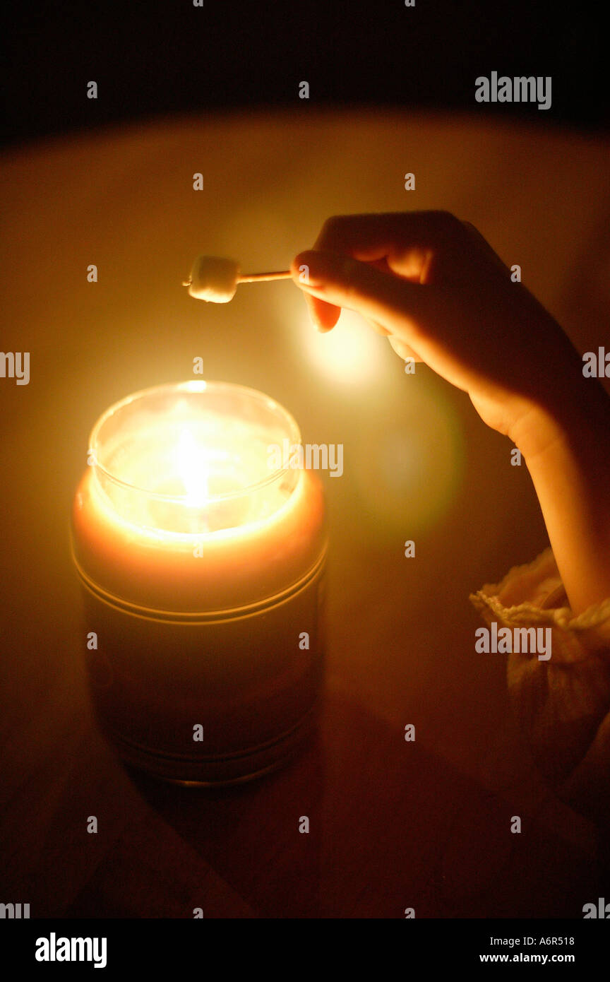 Roasting miniature marshmallow s over a candle is a simple but poignant ...