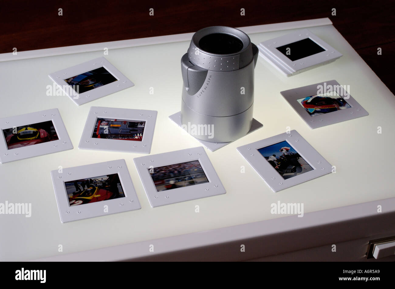 35 mm slides and a loupe on a light table Stock Photo - Alamy