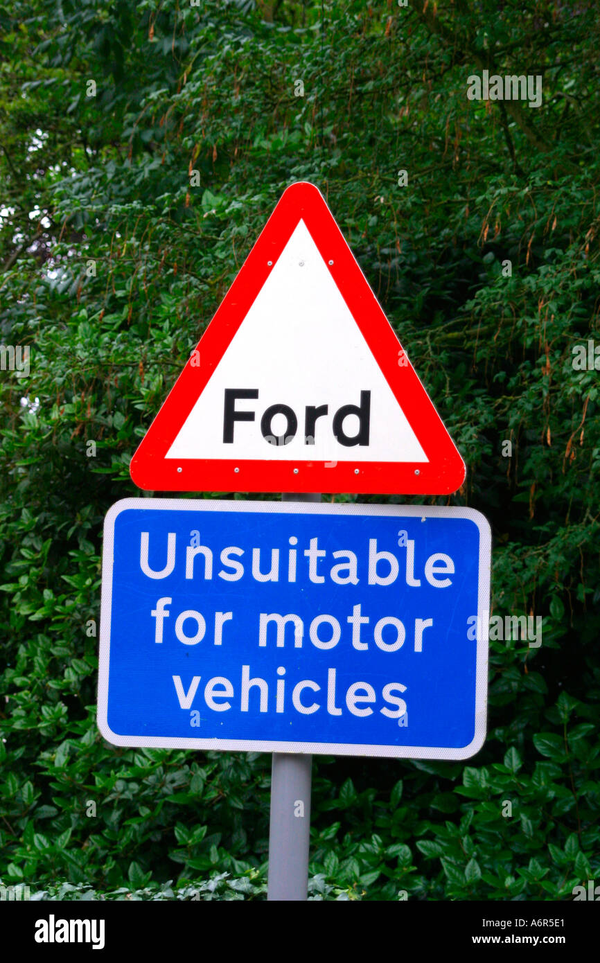 Amusing juxtaposition of signs for ford and not suitable for motor ...