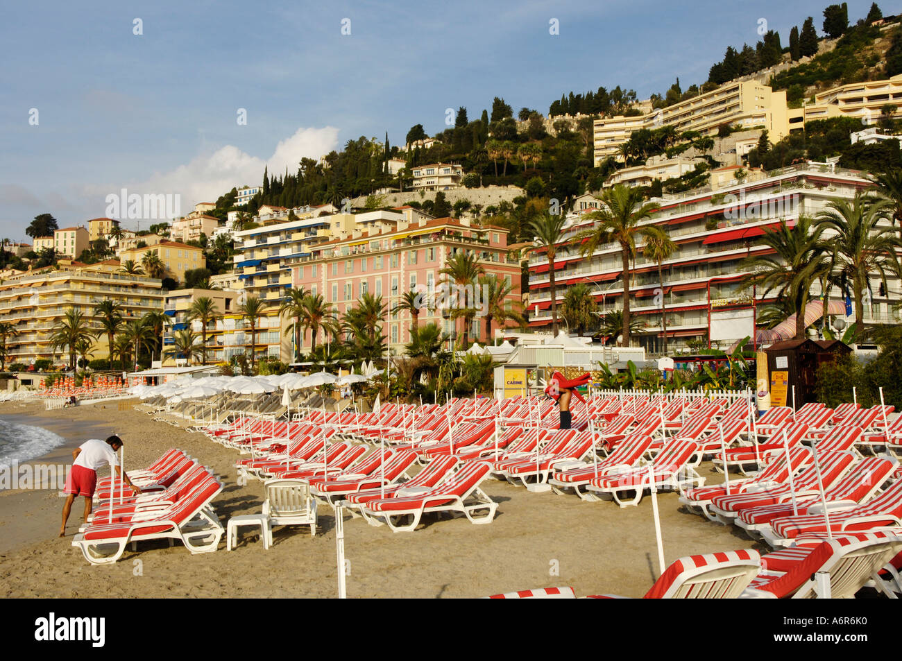 Menton, beach with red sunloungers Stock Photo - Alamy