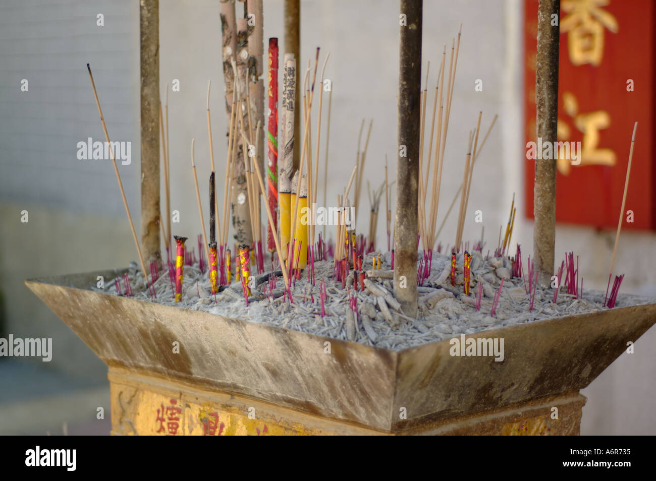 Incense offering by a worshipper at a local temple in Stanley Hong Kong ...