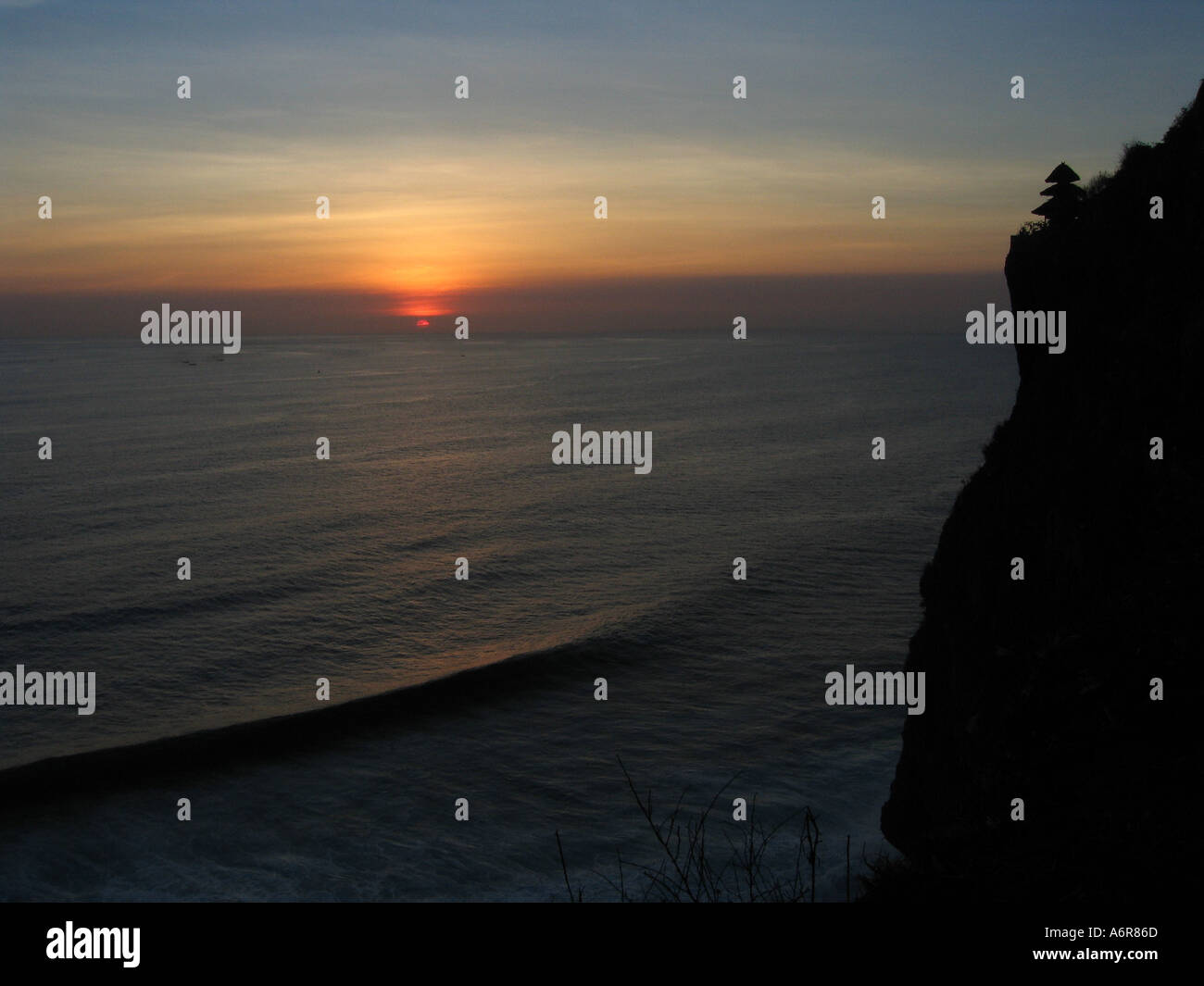 Uluwatu temple at sunset in Bali Indonesia Asia Stock Photo - Alamy