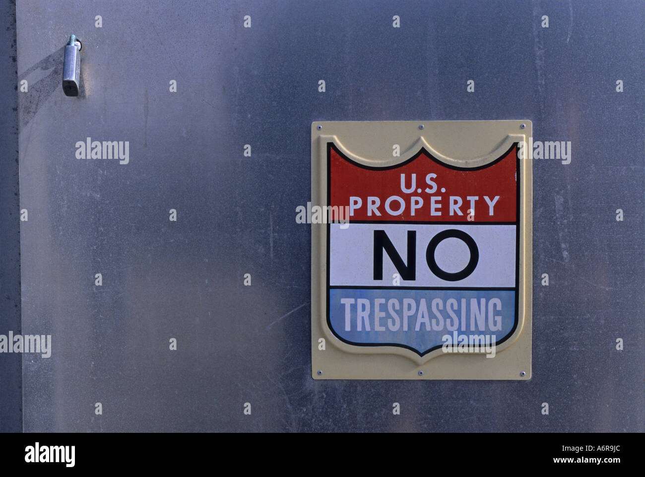 "U.S. Property "No Trespassing" sign on an "electrical installation ...
